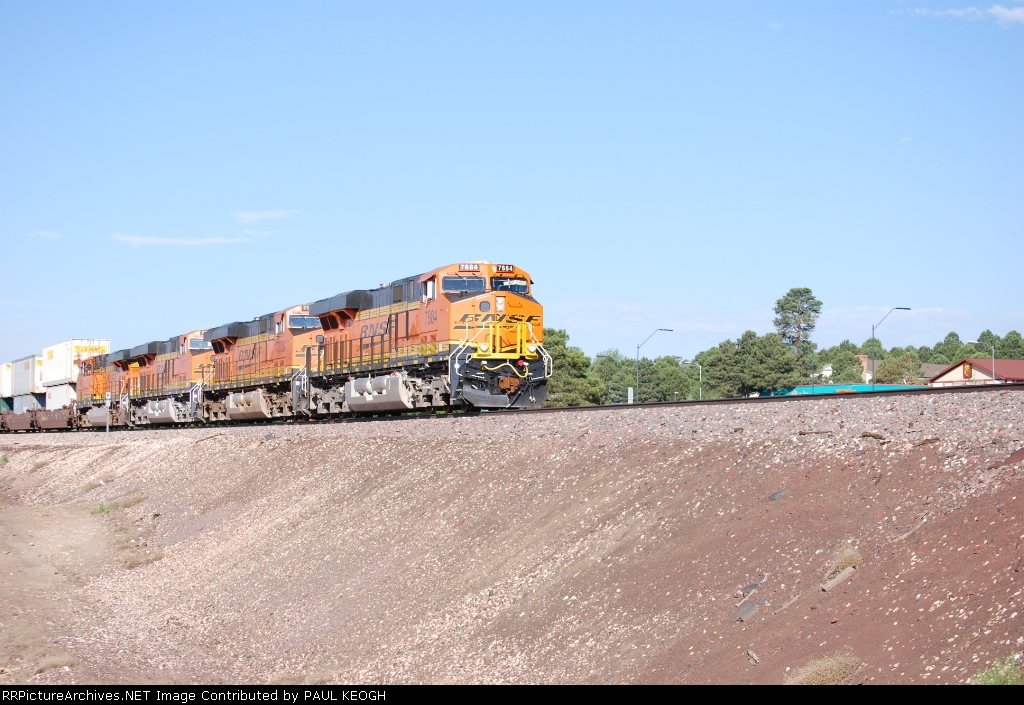 BNSF 7884 with BNSF 7871 as the #3 unit rolls eastbound with a JB Hunt Z-Train.